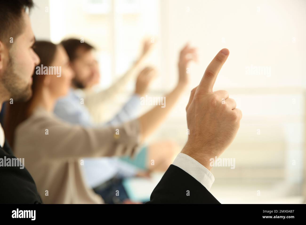 Woman raising finger question hi-res stock photography and images - Alamy