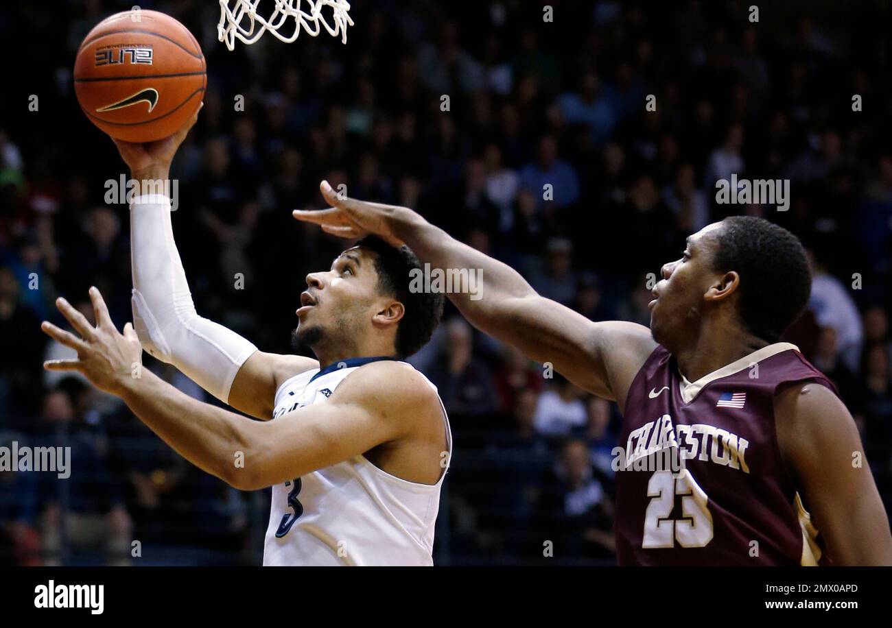 Villanova guard Josh Hart (3) is fouled by Charleston forward Nick ...