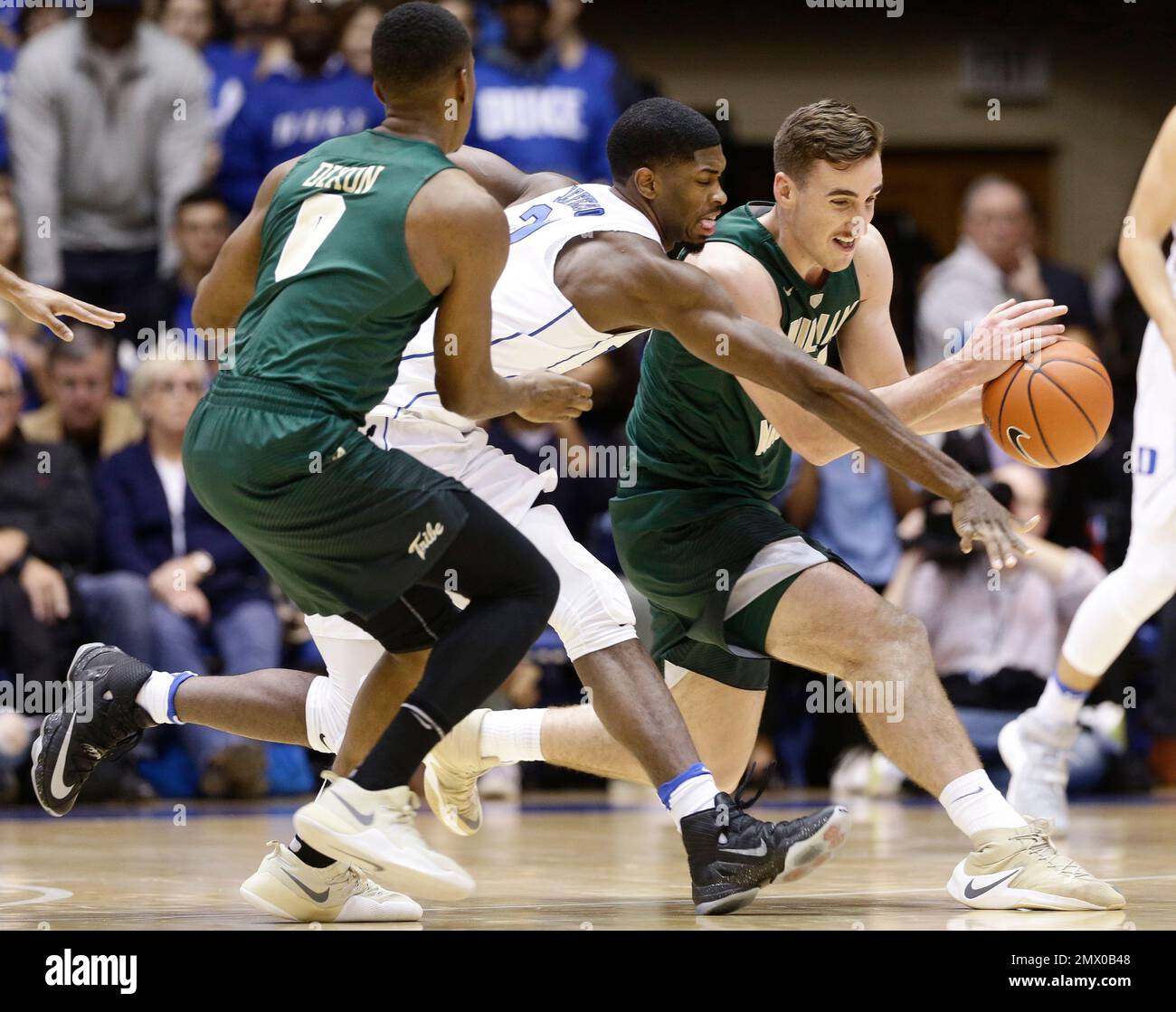 Duke's Amile Jefferson reaches between William & Mary's Daniel Dixon (0 ...