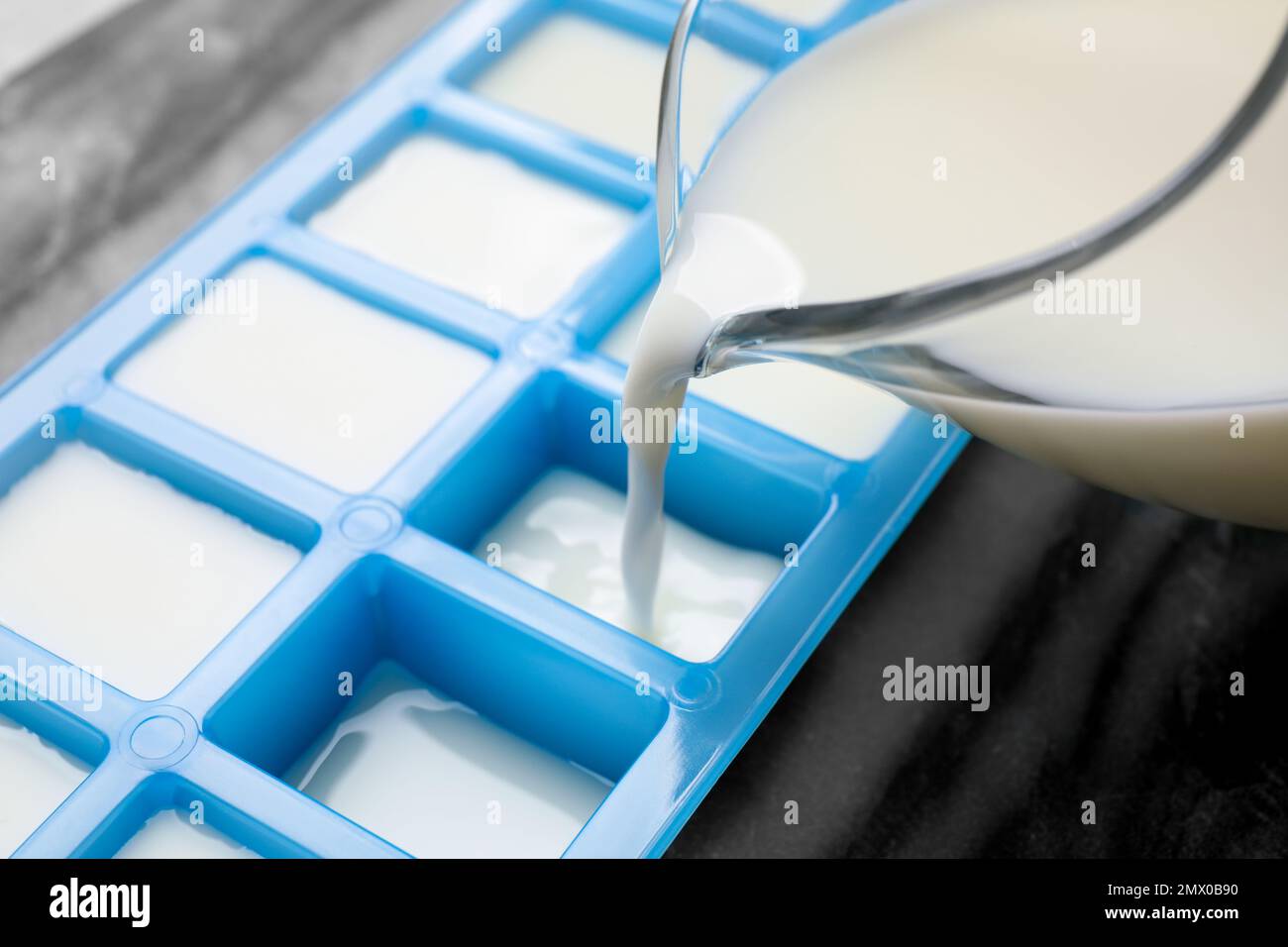 Pouring water into ice tray hi-res stock photography and images - Alamy
