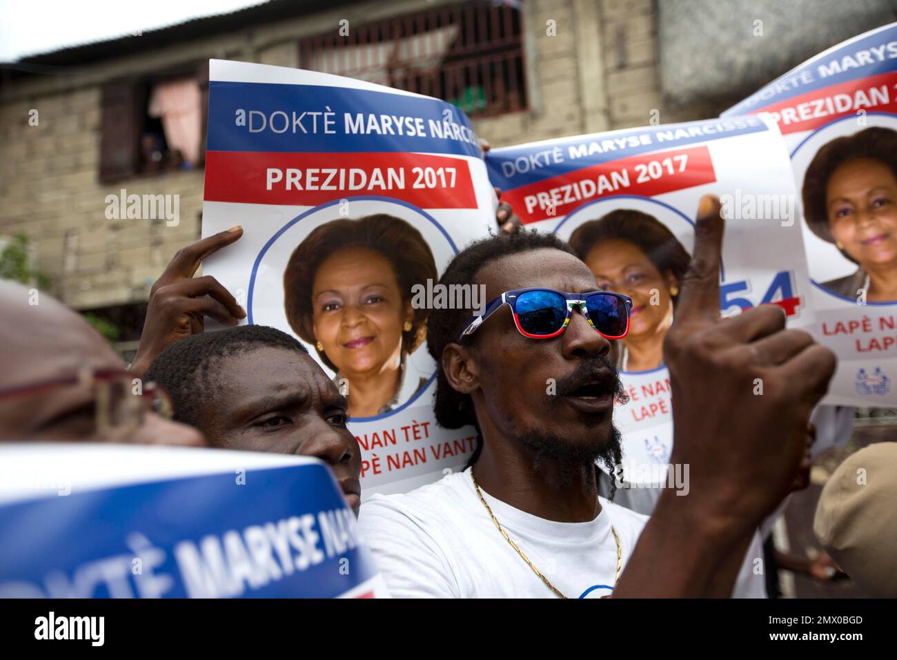 A supporter of presidential candidate Maryse Narcisse from Fanmi ...
