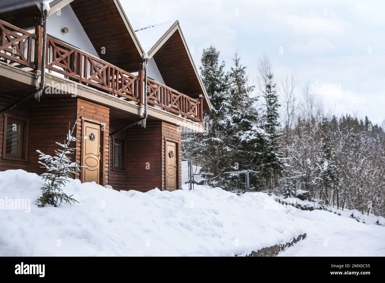 Modern wooden hotel covered with snow. Winter vacation Stock Photo - Alamy