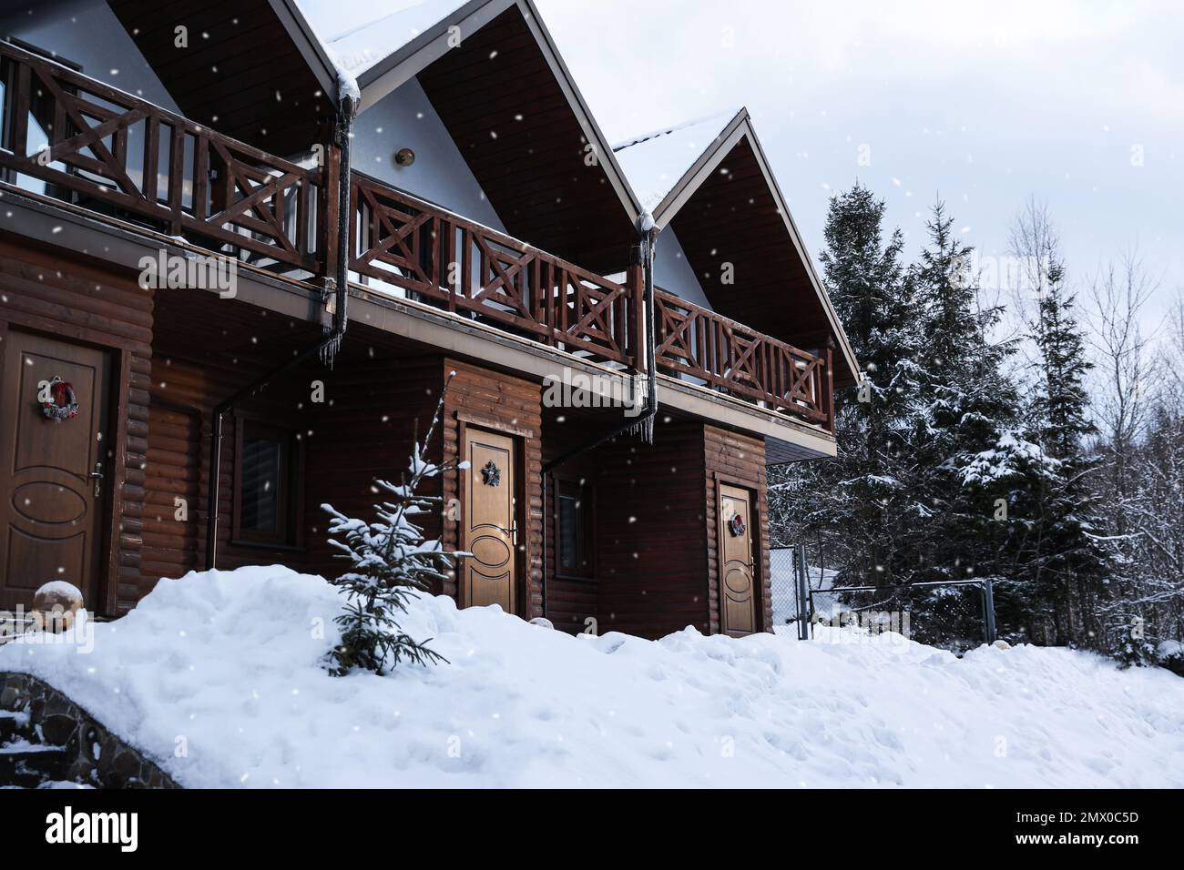 Modern wooden hotel covered with snow. Winter vacation Stock Photo - Alamy