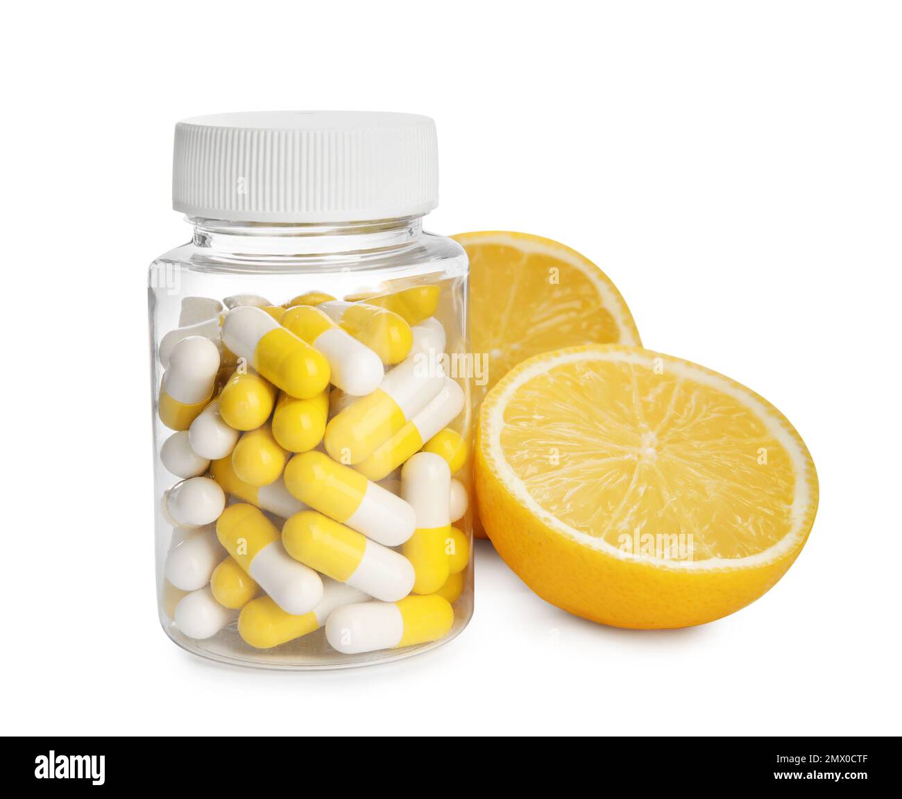 Bottle with vitamin pills and lemon on white background Stock Photo - Alamy