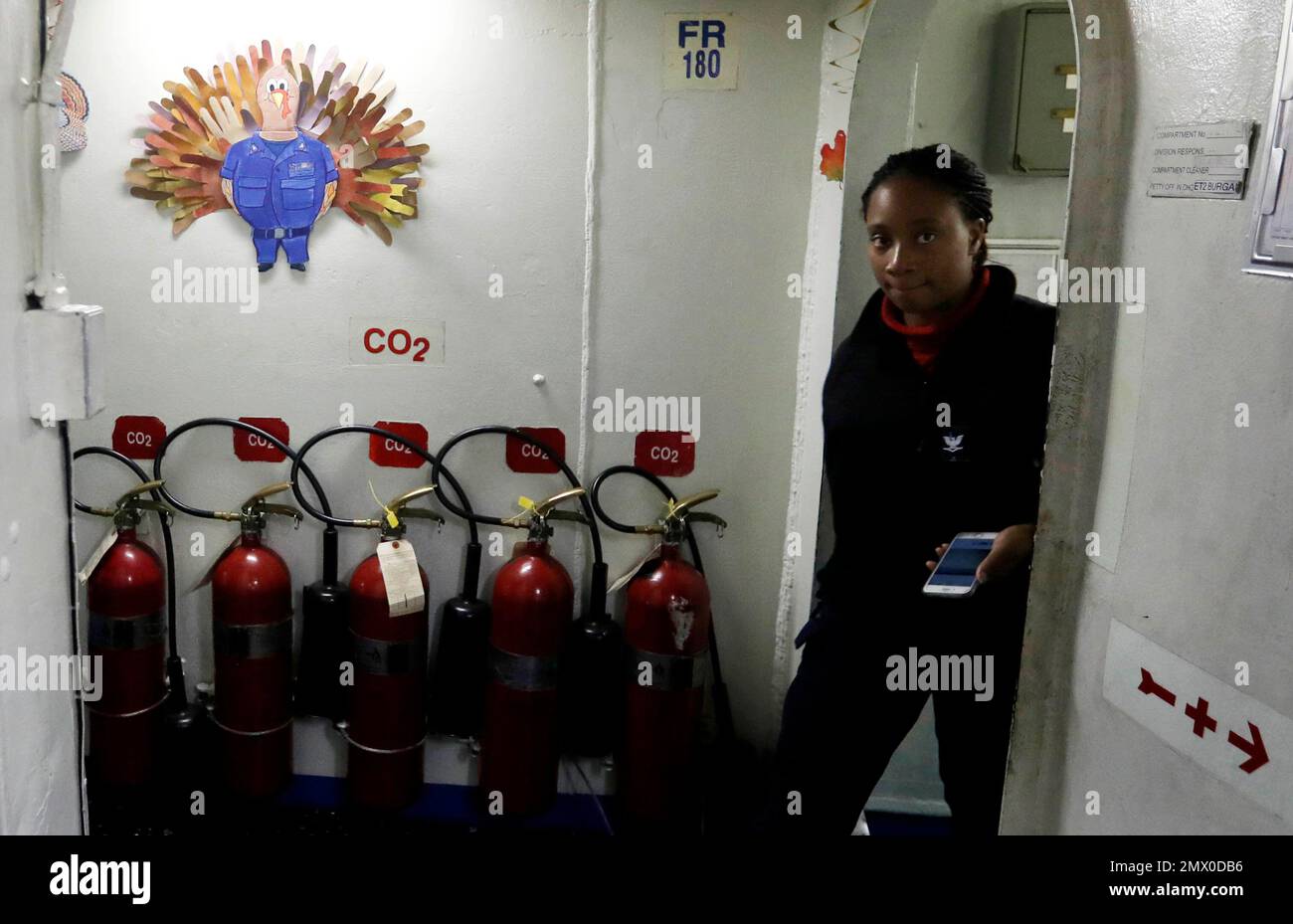 In this picture taken on Tuesday, Nov. 22, 2016, a US navy sailor walks ...