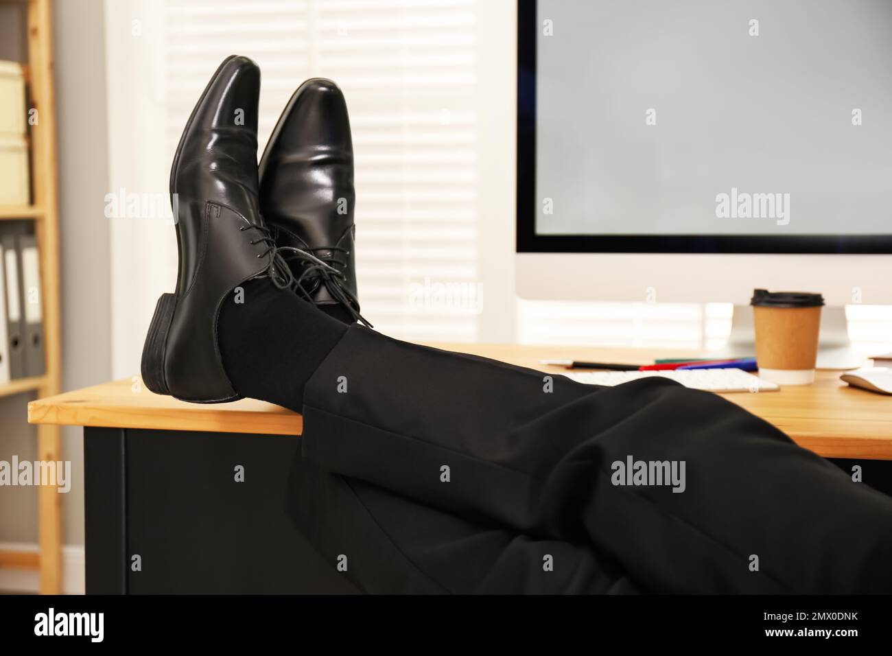 Lazy businessman with feet up hi-res stock photography and images - Alamy
