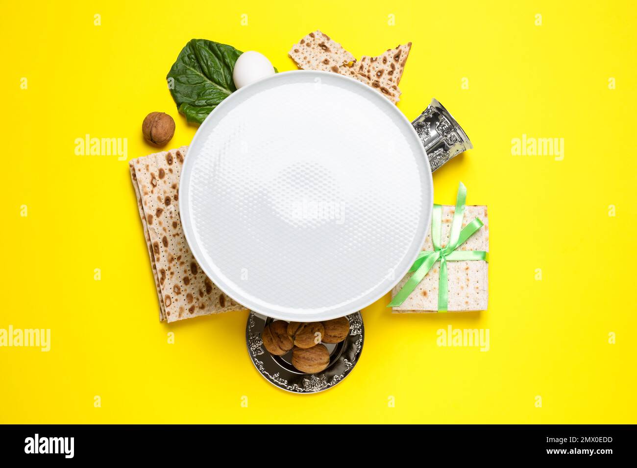 Frame made with symbolic Passover items on yellow background, space for ...