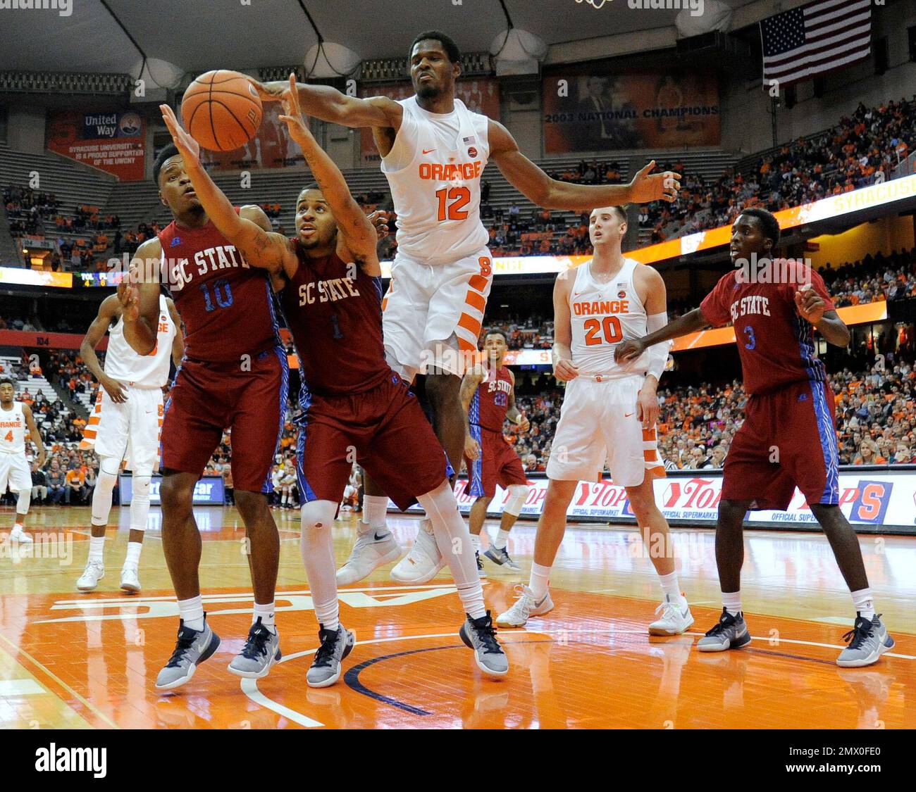 Syracuse's Taurean Thompson, top, reaches for the ball over South ...
