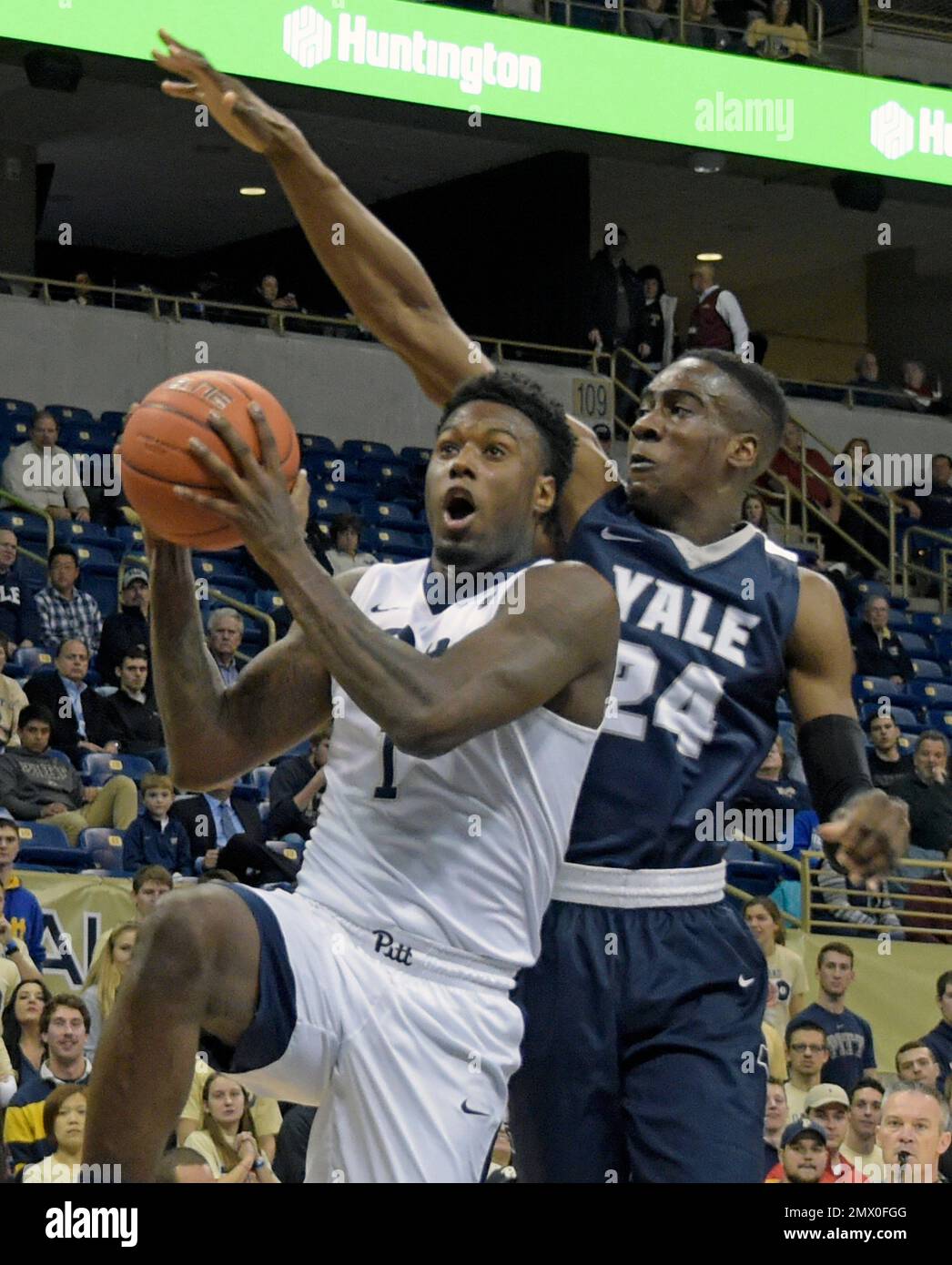 Yale guard Miye Oni (24) tries to block the shot of Pittsburgh forward ...