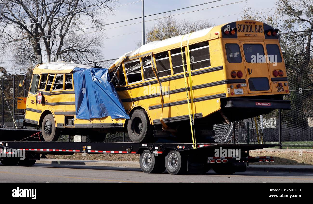A school bus is carried away Tuesday, Nov. 22, 2016, in Chattanooga ...