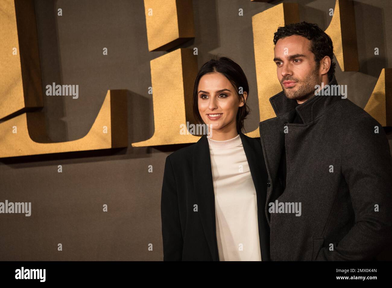 Lucy Watson and James Dunmore pose for photographers upon arrival at ...