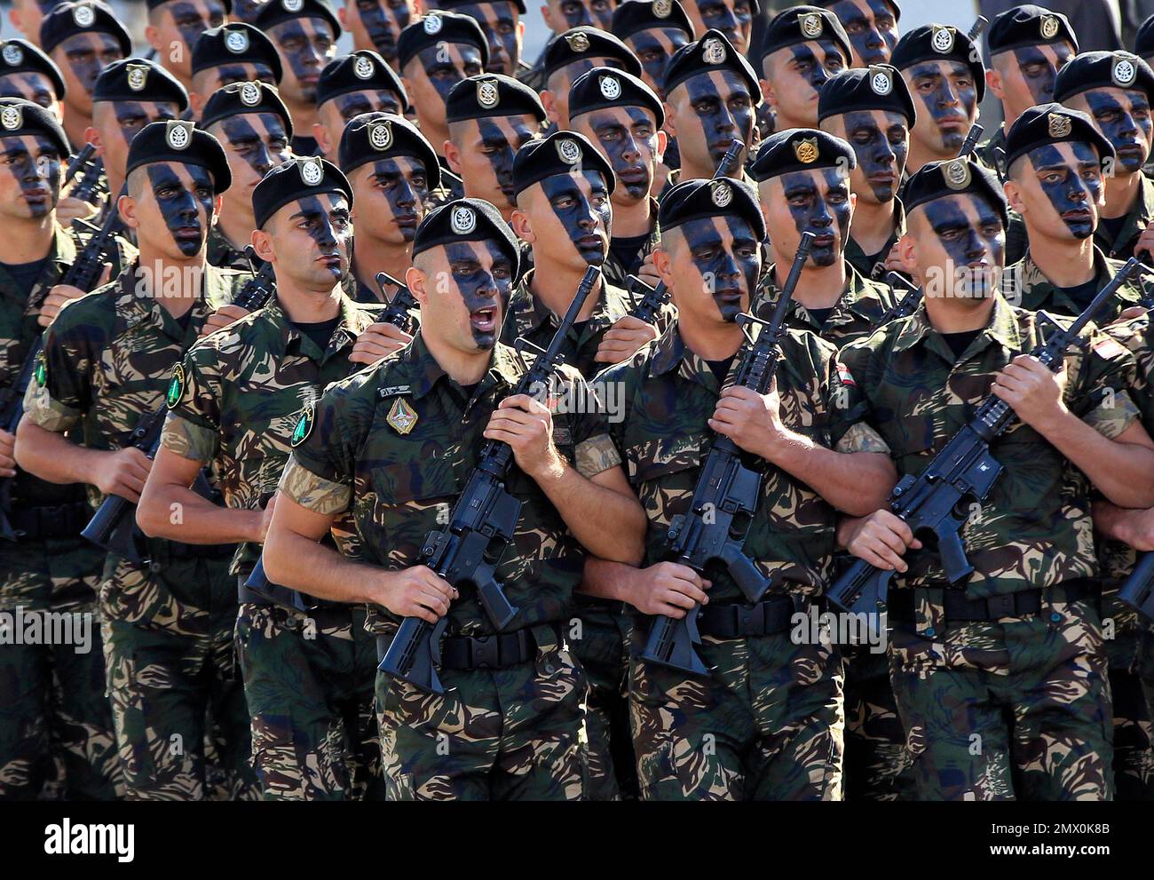 Lebanese army soldiers march during a military parade to mark the 73rd ...