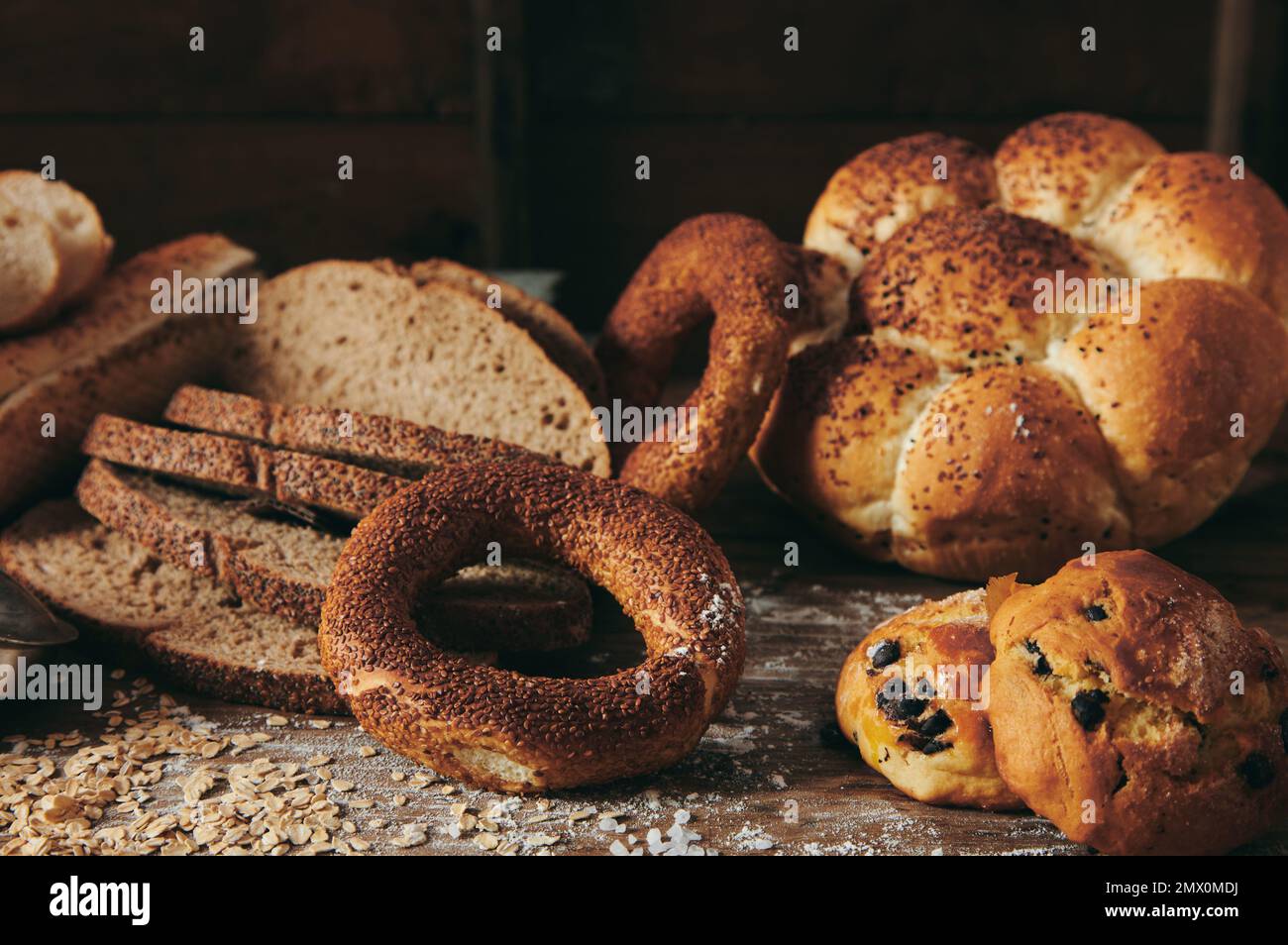 Slices of fresh Turkish bread on table with mix of sweet baked pastry ...