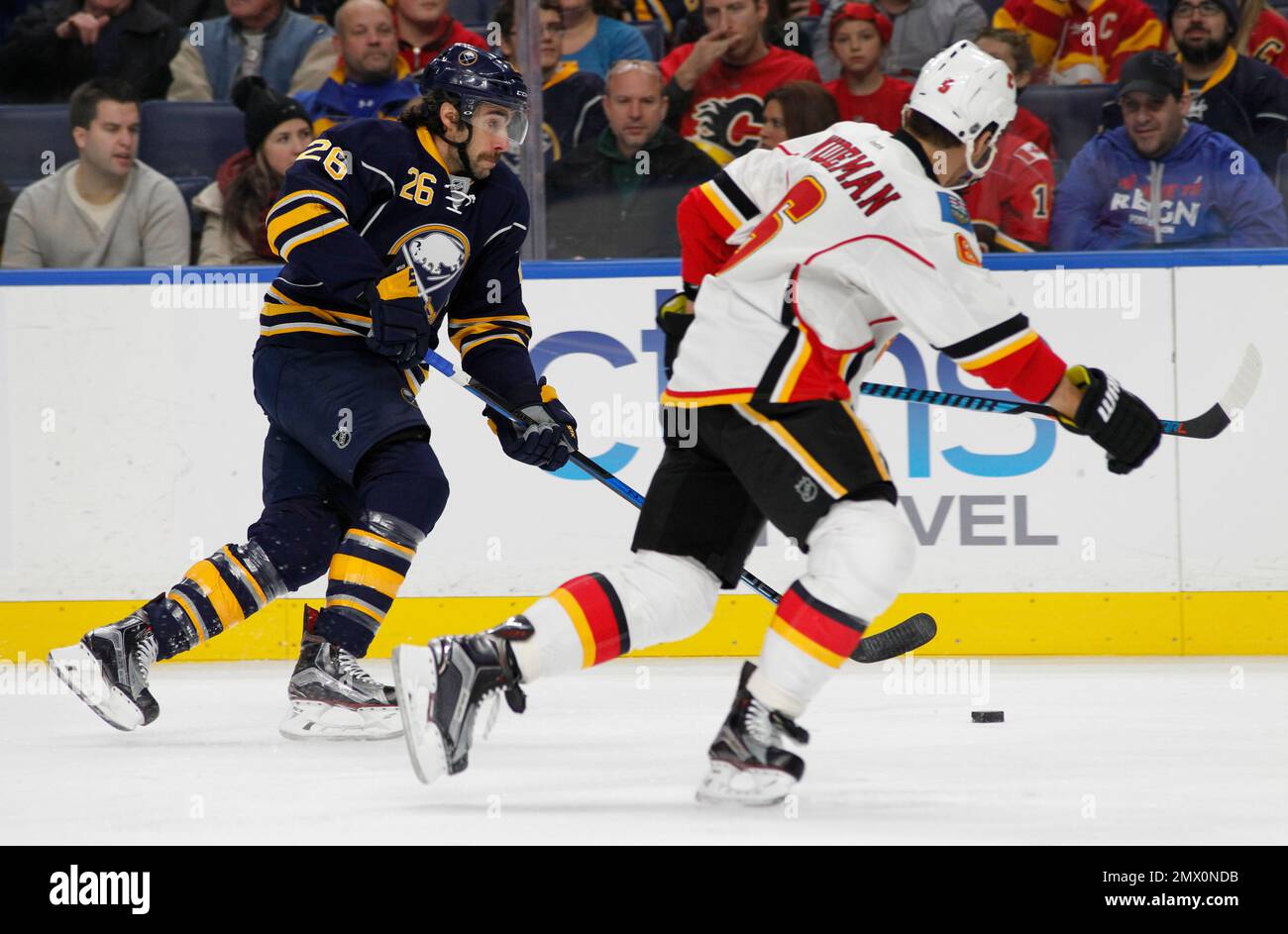 Buffalo Sabres forward Matt Moulson (26) and Calgary Flames defenseman ...