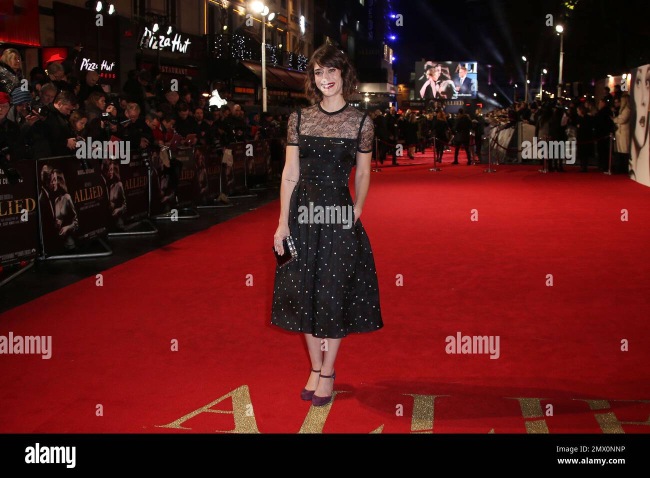 Lizzy Caplan poses for photographers upon arrival at the premiere of ...