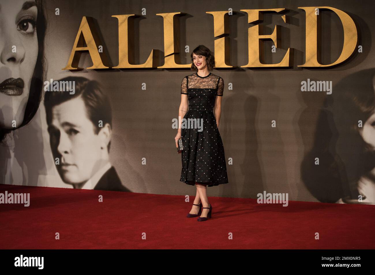 Actress Lizzy Caplan poses for photographers upon arrival at the ...