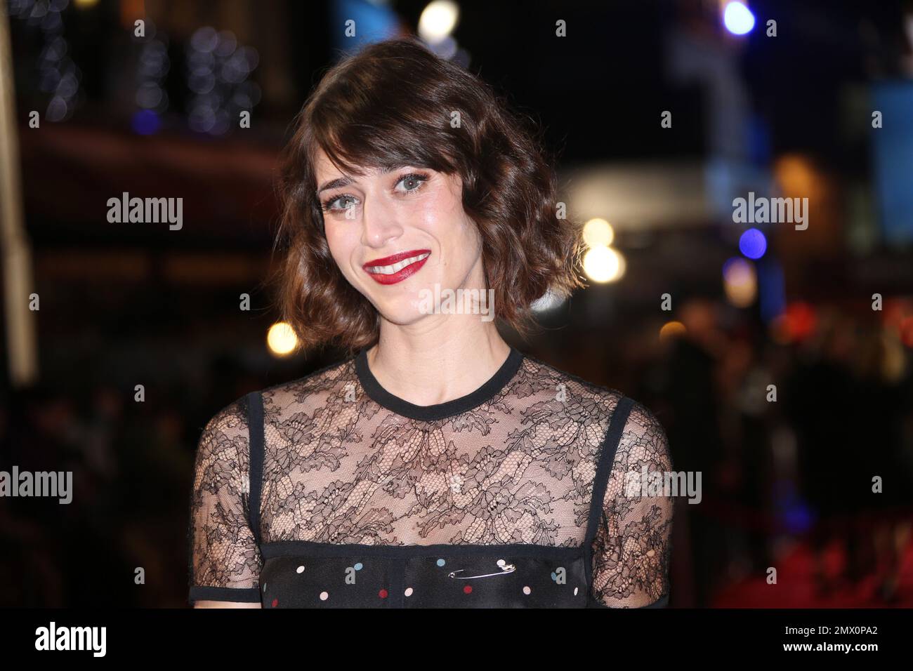 Actress Lizzy Caplan poses for photographers upon arrival at the ...