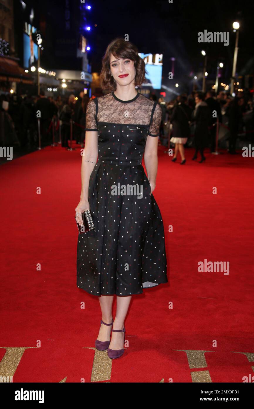 Actress Lizzy Caplan poses for photographers upon arrival at the ...
