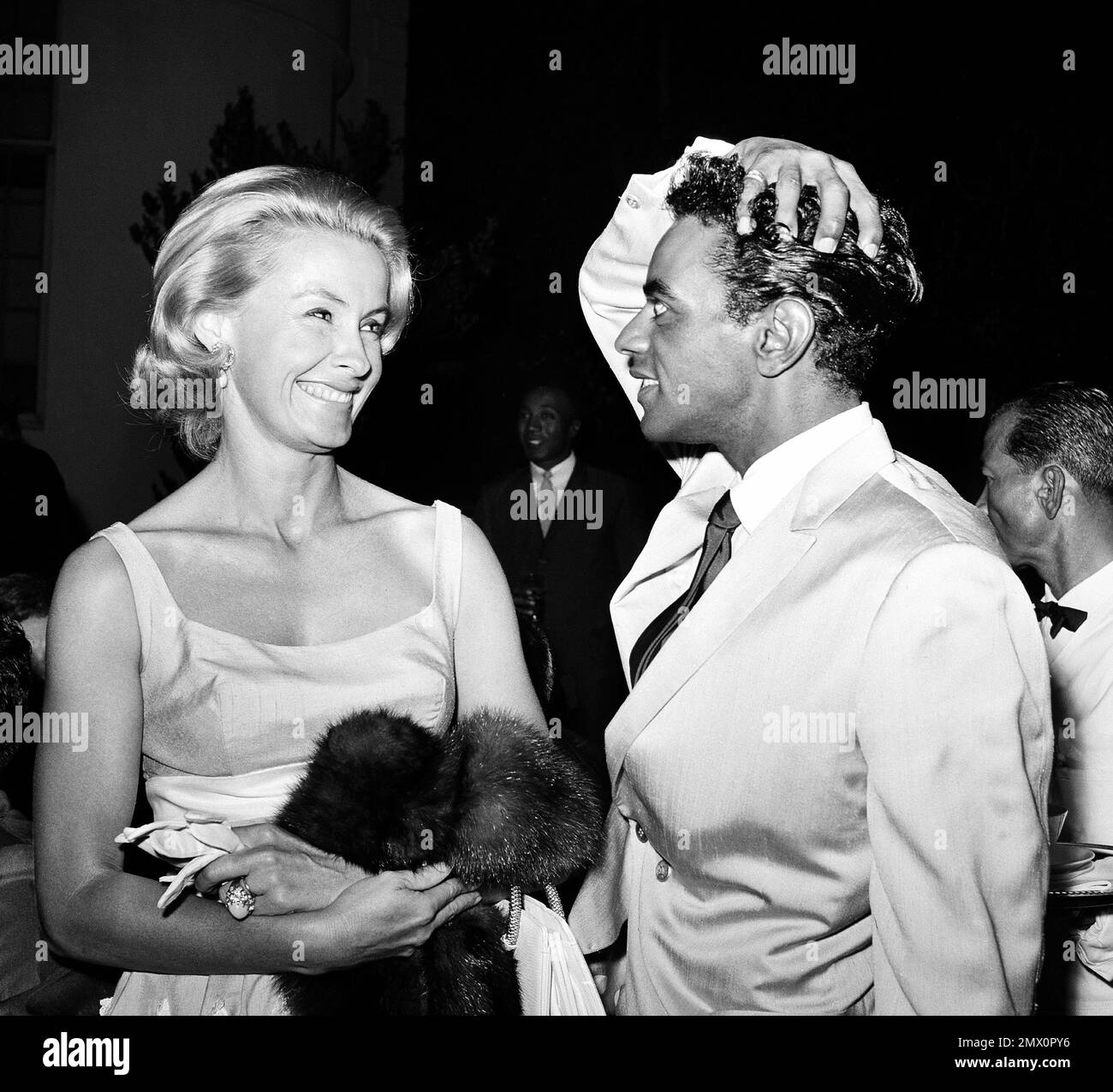 Singer Johnny Mathis, right, guest of honor, shown with Dina Merrill ...