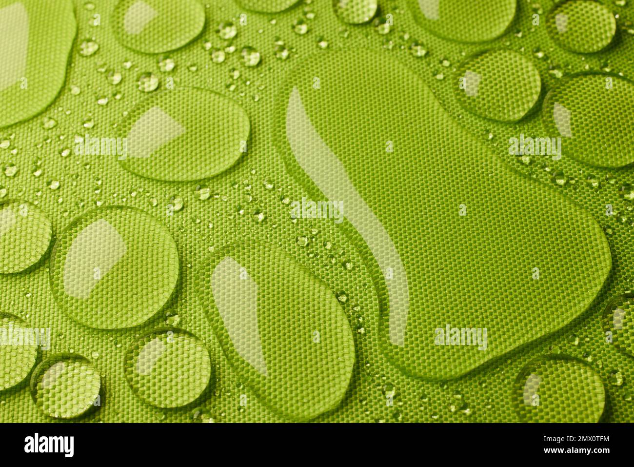 From above green background with closeup water drops in different ...