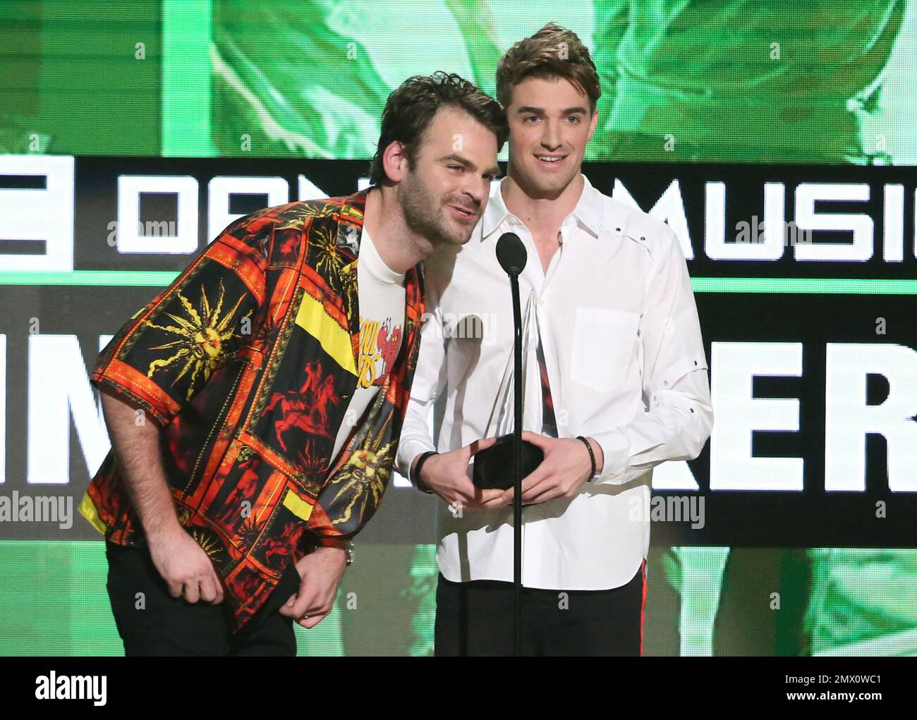 Alex Pall, left, and Andrew Taggart, of The Chainsmokers, accept the ...