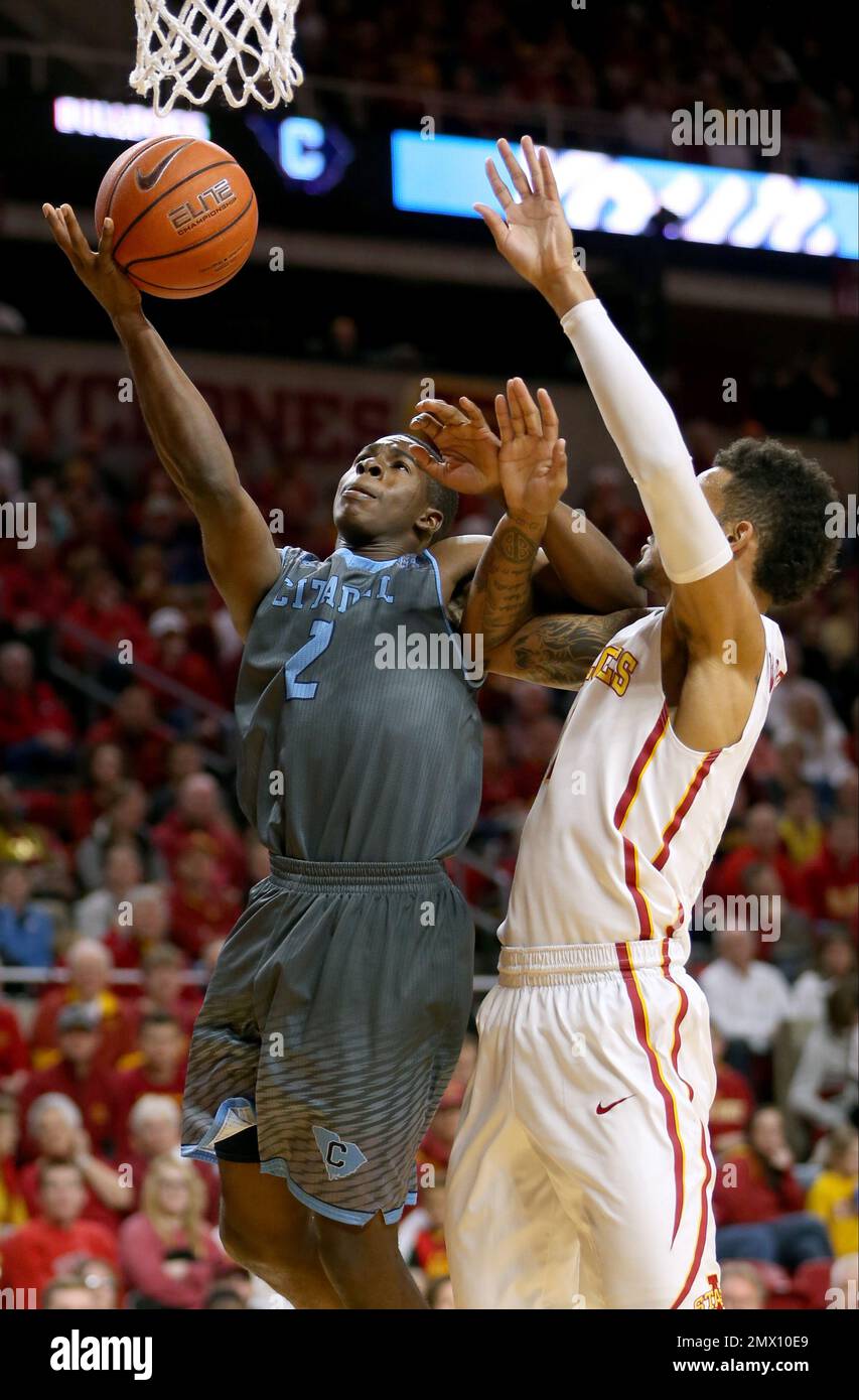 Citadel guard Quayson Williams is fouled by Iowa State guard Nick Weiler-Babb as he goes up for ...