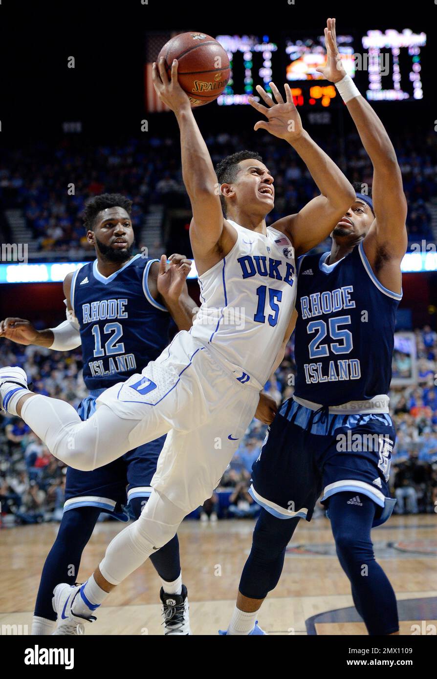 Duke's Frank Jackson shoots as Rhode Island's Hassan Martin, left, and ...