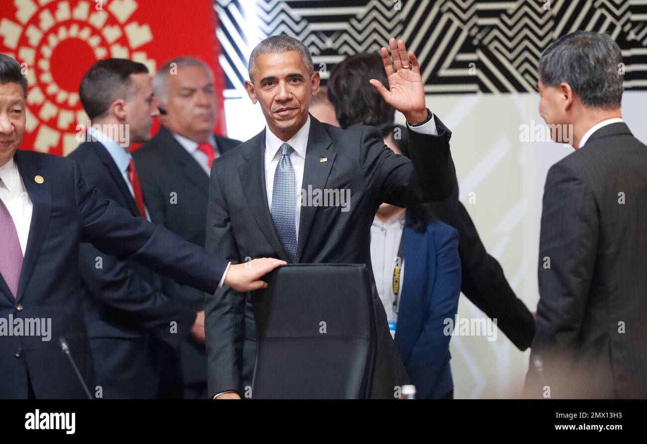 U.S. President Barack Obama, center, appears at the opening session of ...