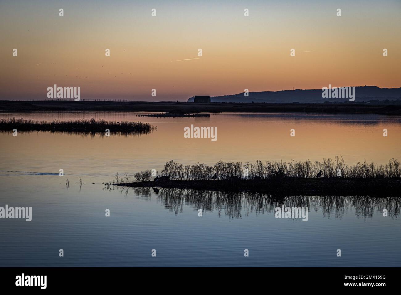 Sunset over Rye Harbour Nature Reserve, East Sussex, England Stock ...
