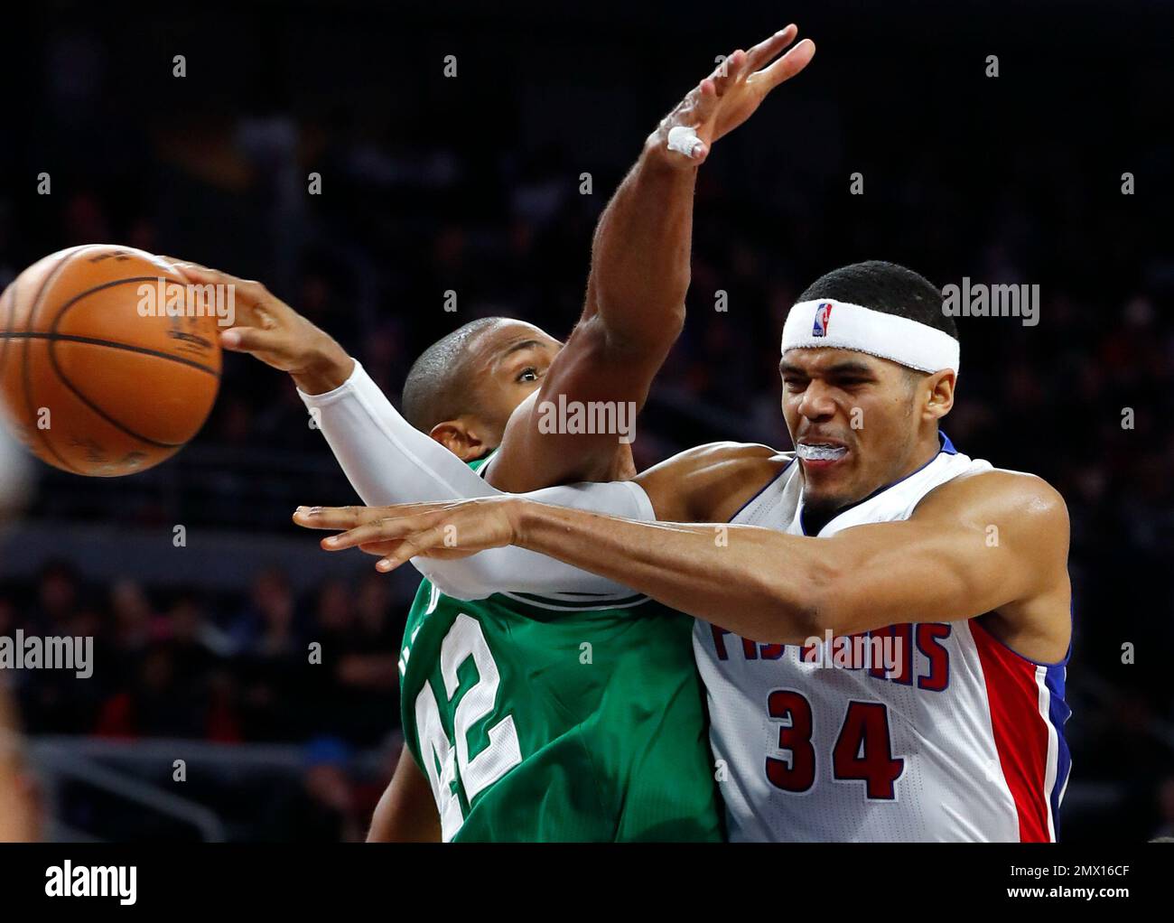 Detroit Pistons forward Tobias Harris (34) passes around Boston Celtics ...