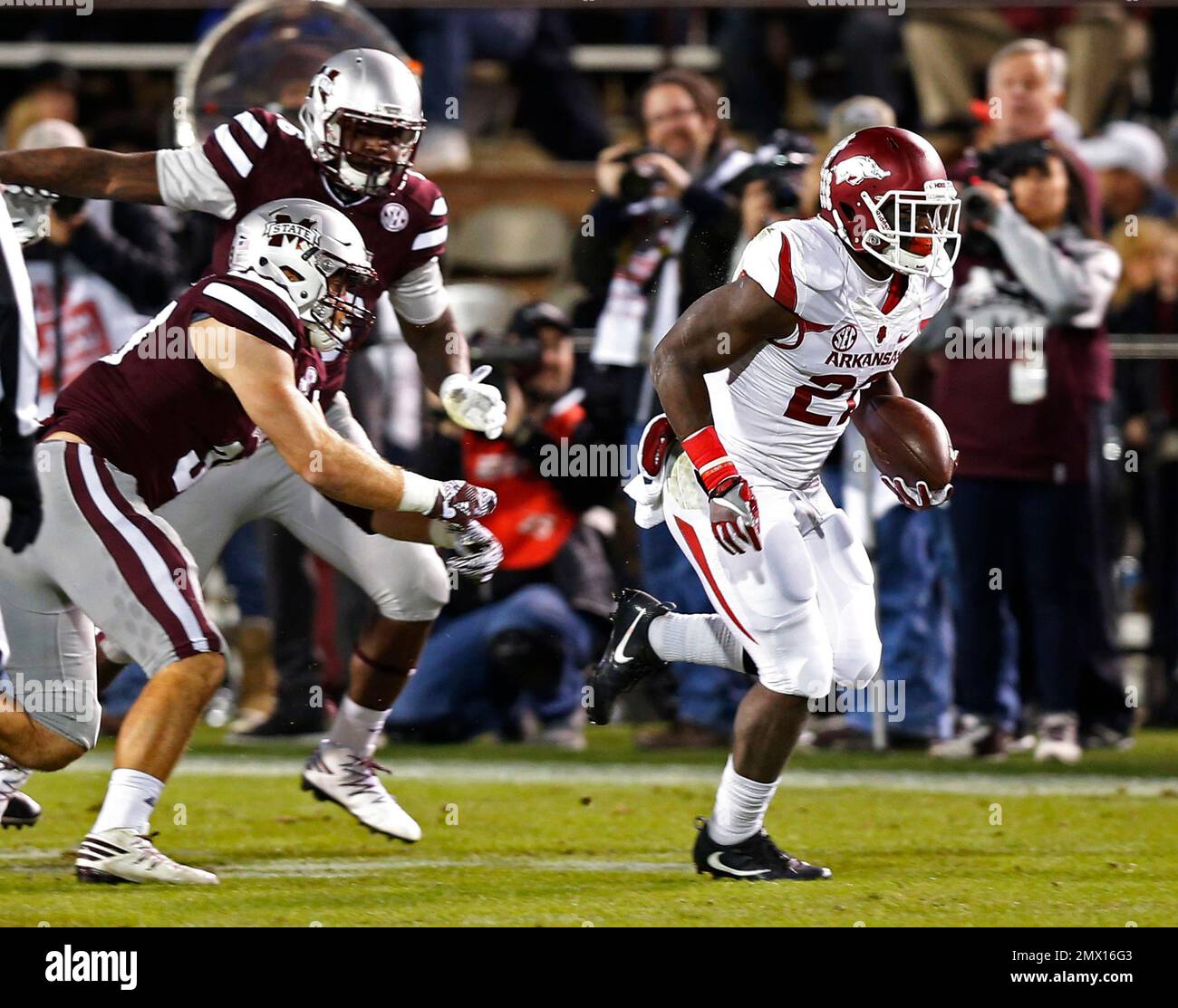 Arkansas running back Rawleigh Williams III (22) runs past Mississippi ...