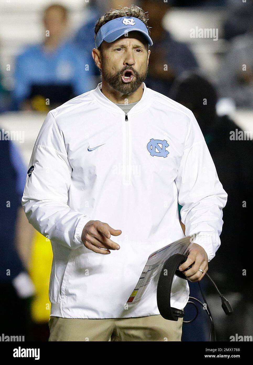 North Carolina head coach Larry Fedora speaks with an official during ...