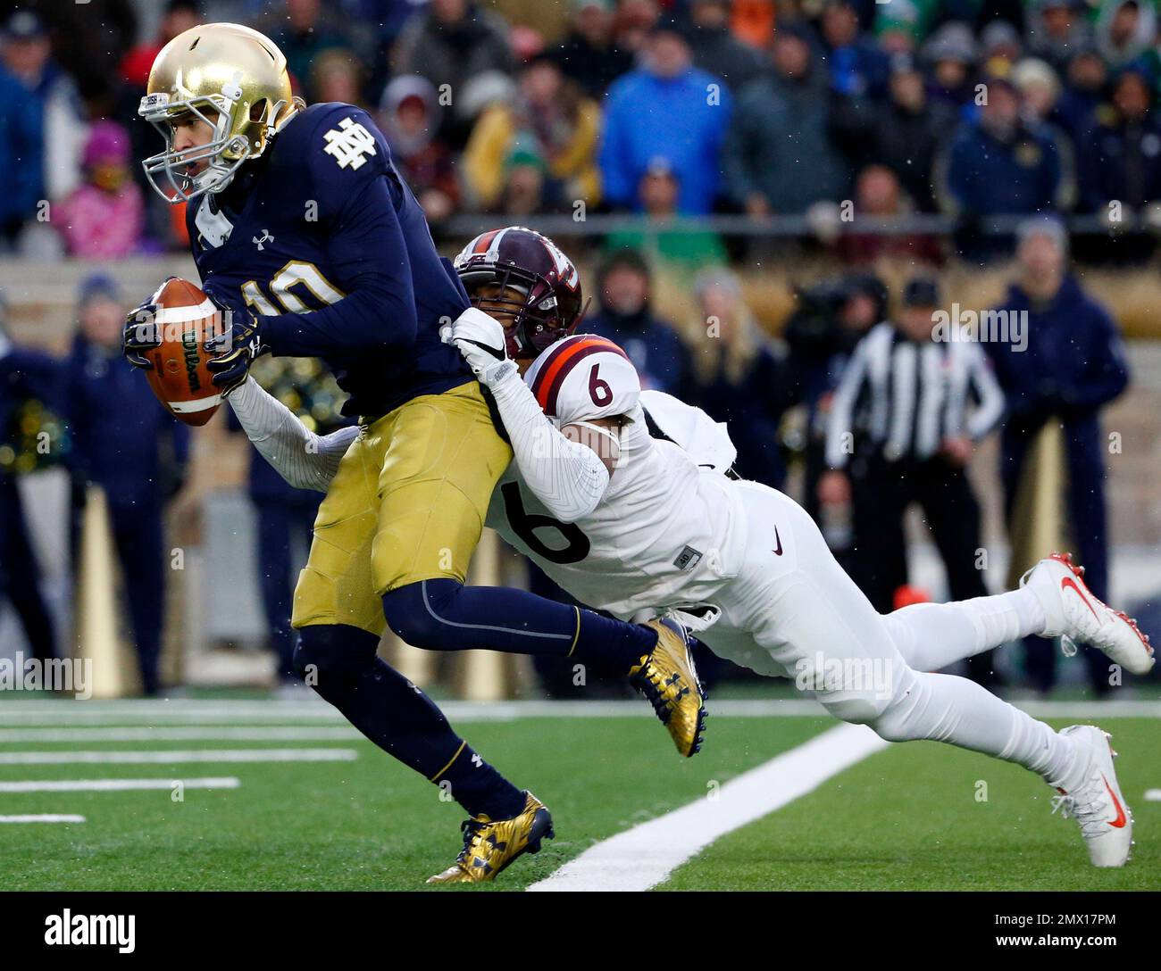 Notre Dame wide receiver Chris Finke, left, catches a touchdown pass ...
