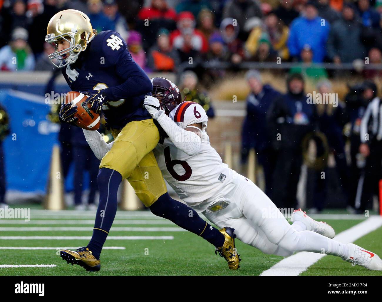 Notre Dame wide receiver Chris Finke, left, catches a touchdown pass ...