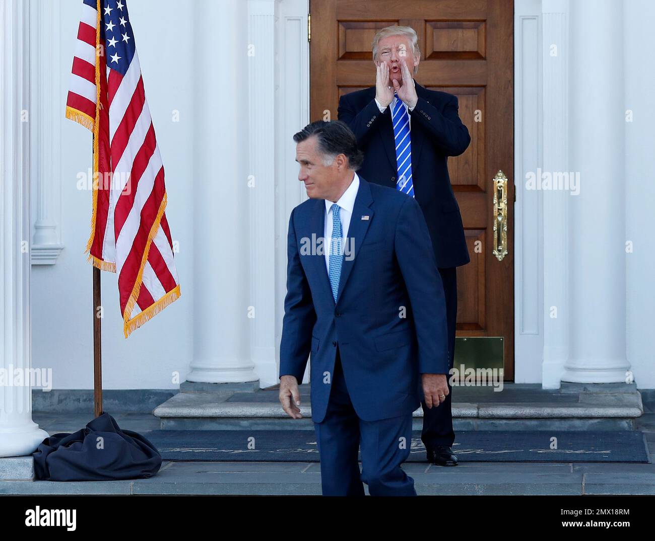 President-elect Donald Trump calls out to the media as Mitt Romney ...