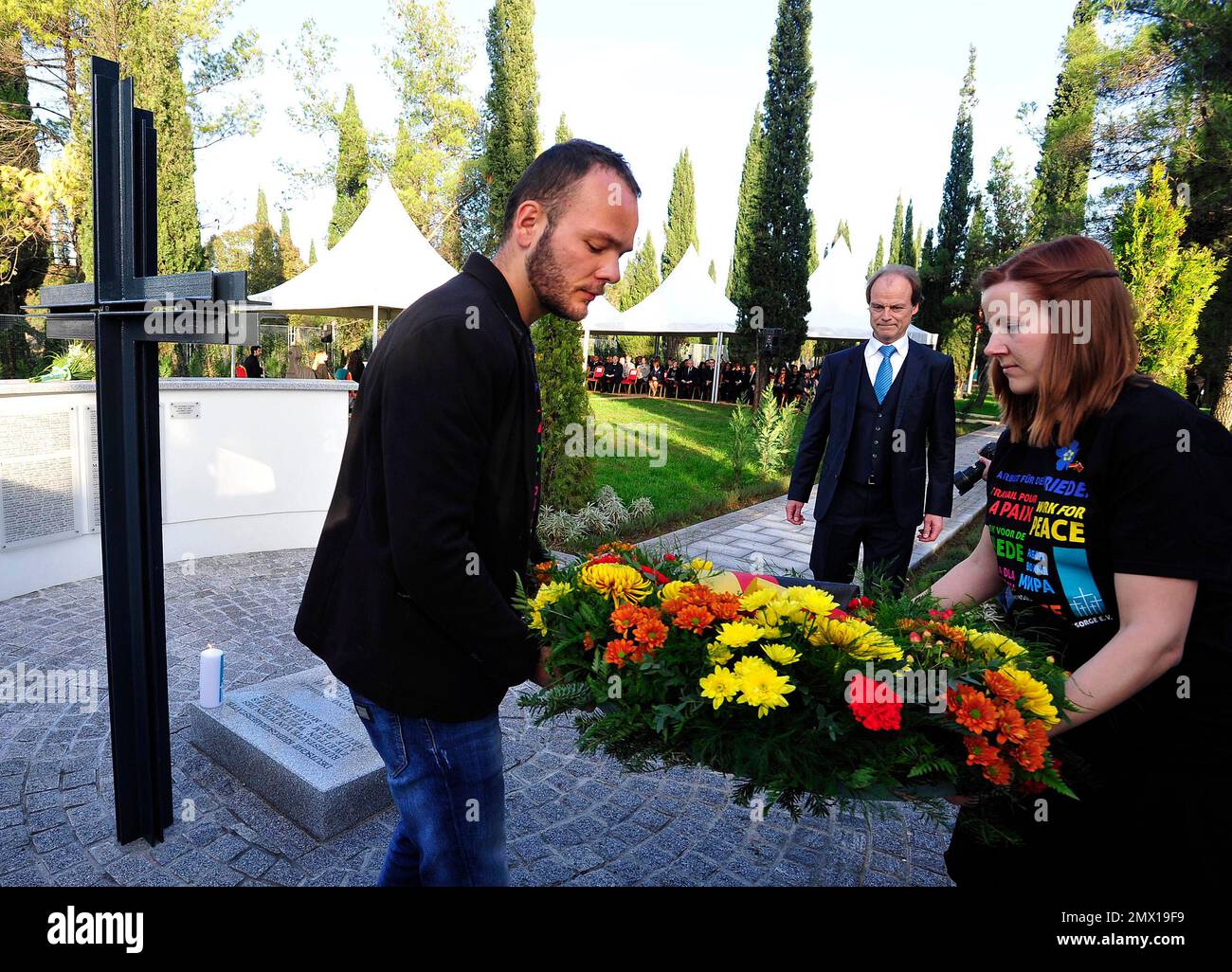 German ambassador in Montenegro Hans Gunther Mattern, center, lays ...