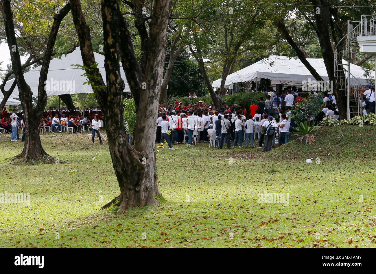 Hundreds of followers attend a mass at the graveyard of the late ...