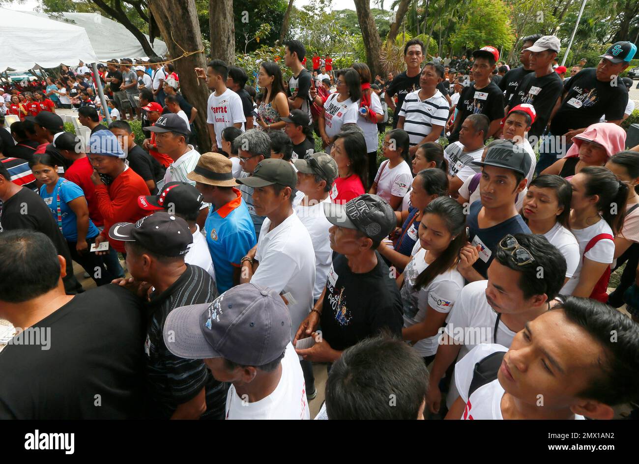 Hundreds of supporters attend a mass at the graveyard of the late ...