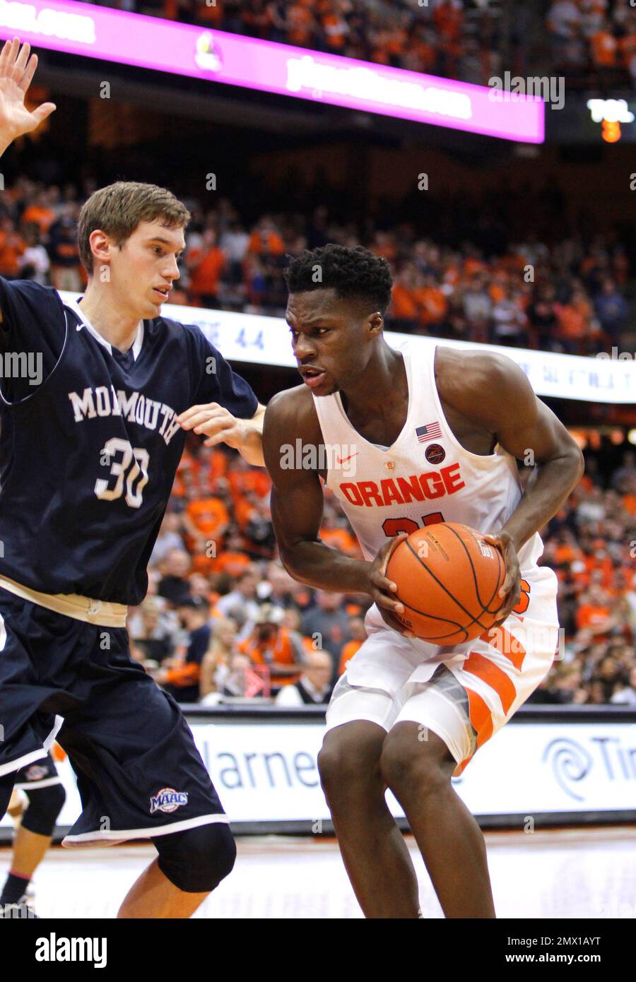 Syracuse's Tyler Roberson, right, shoots against Monmouth Collin ...