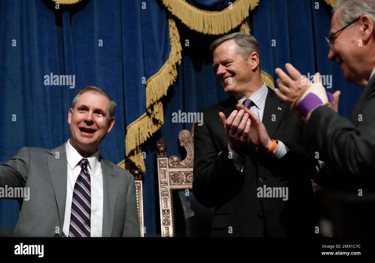 Supreme Judicial Court justice David Lowy, left, receives applause by ...