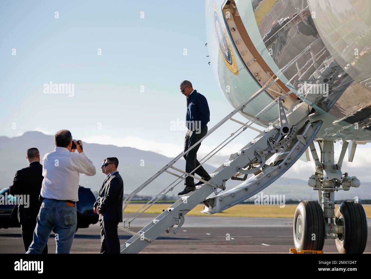 President Barack Obama steps off Air Force One during refueling stop at ...