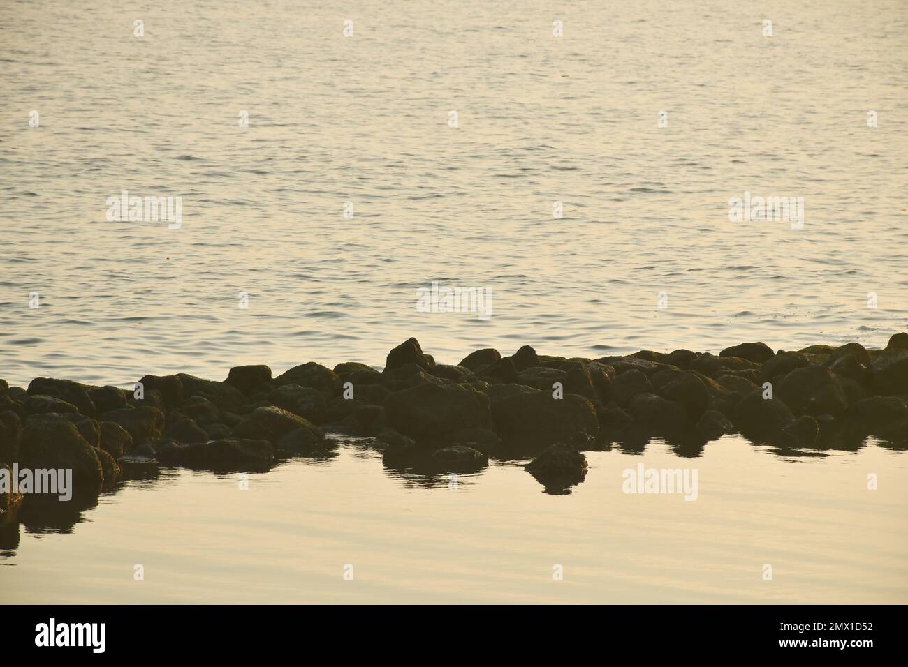 sea flowing and hit to rock for protection beach in Thailand Stock ...
