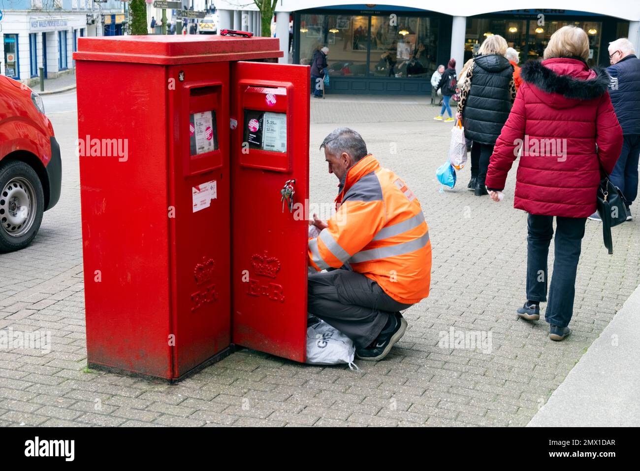 Postman emptying post box hi-res stock photography and images - Alamy