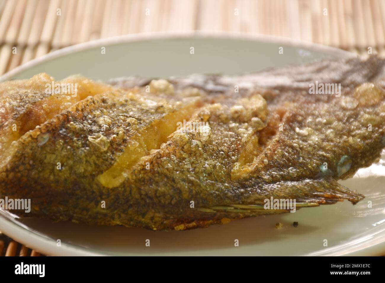 deep fried snake skin catfish or gourami on dish Stock Photo - Alamy