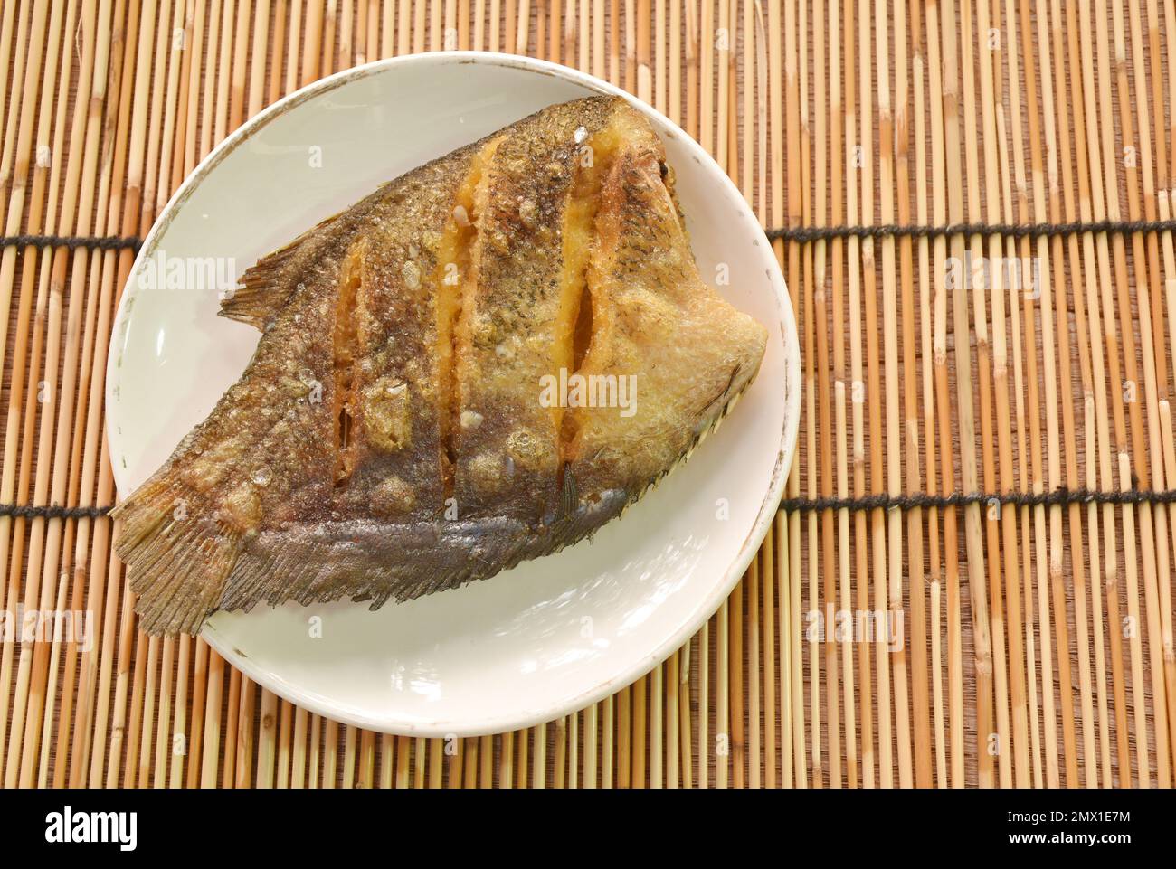 deep fried snake skin catfish or gourami on dish Stock Photo - Alamy