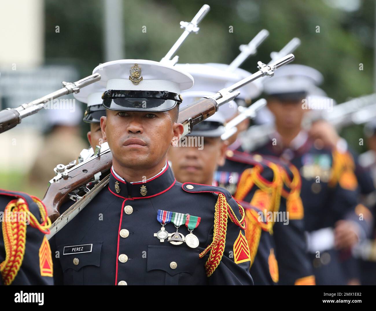 Filipino soldiers walk inside the Heroes' Cemetery where former ...