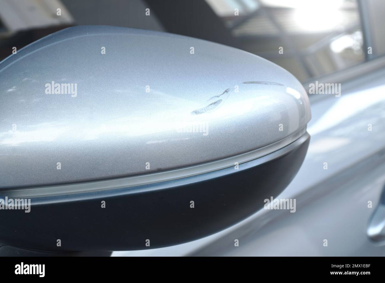 scratch from accident on silver color car side view mirror background ...