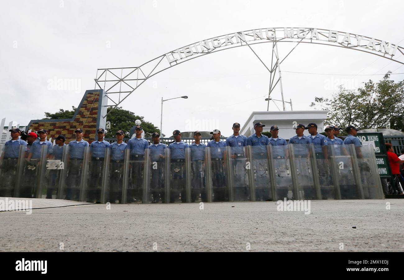 Soldiers with riot shields guard the gates of the Hero's Cemetery as ...