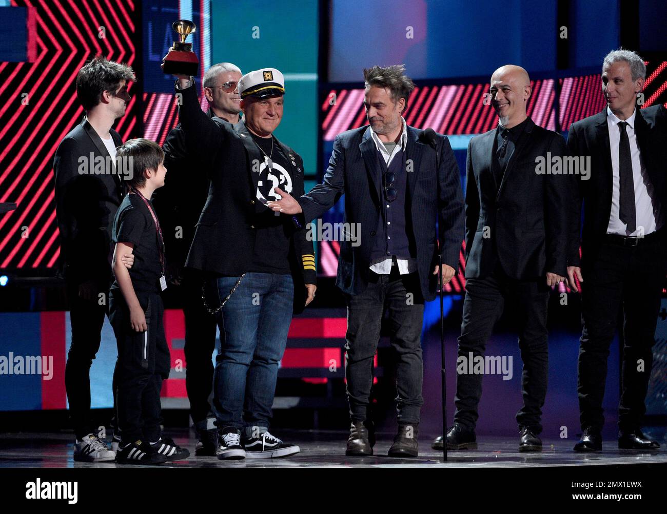 Los Fabulosos Cadillacs accept the award for best rock album for "La ...