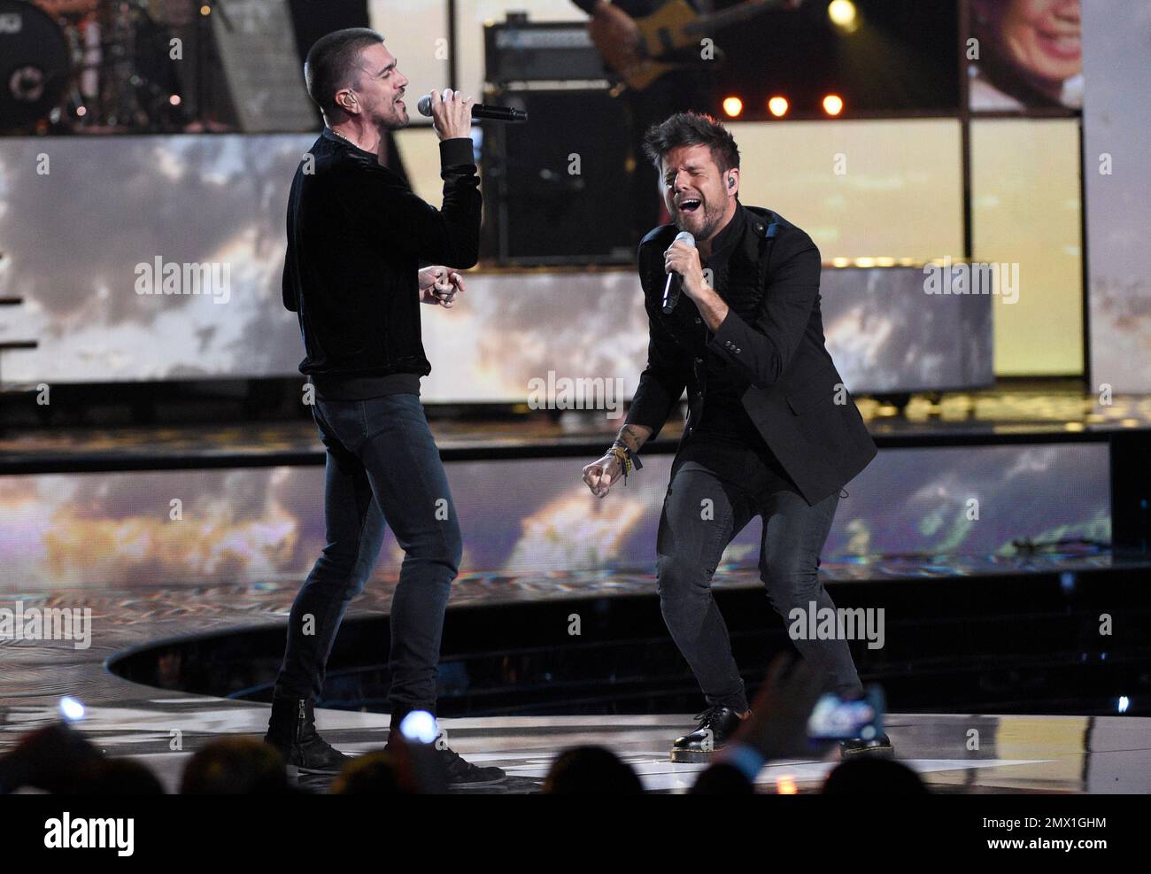 Juanes, left, and Pablo Lopez perform "Tu Enemigo" at the 17th annual ...